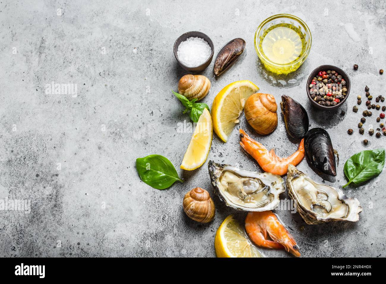 Assortment of fresh seafood: oysters, shrimps, clams, mussels, shells ...