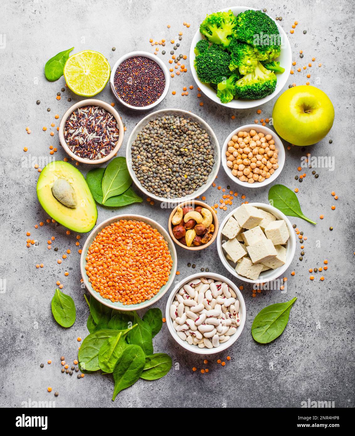 Variety of nutrient-rich food for vegans: beans, lentils, quinoa, tofu ...