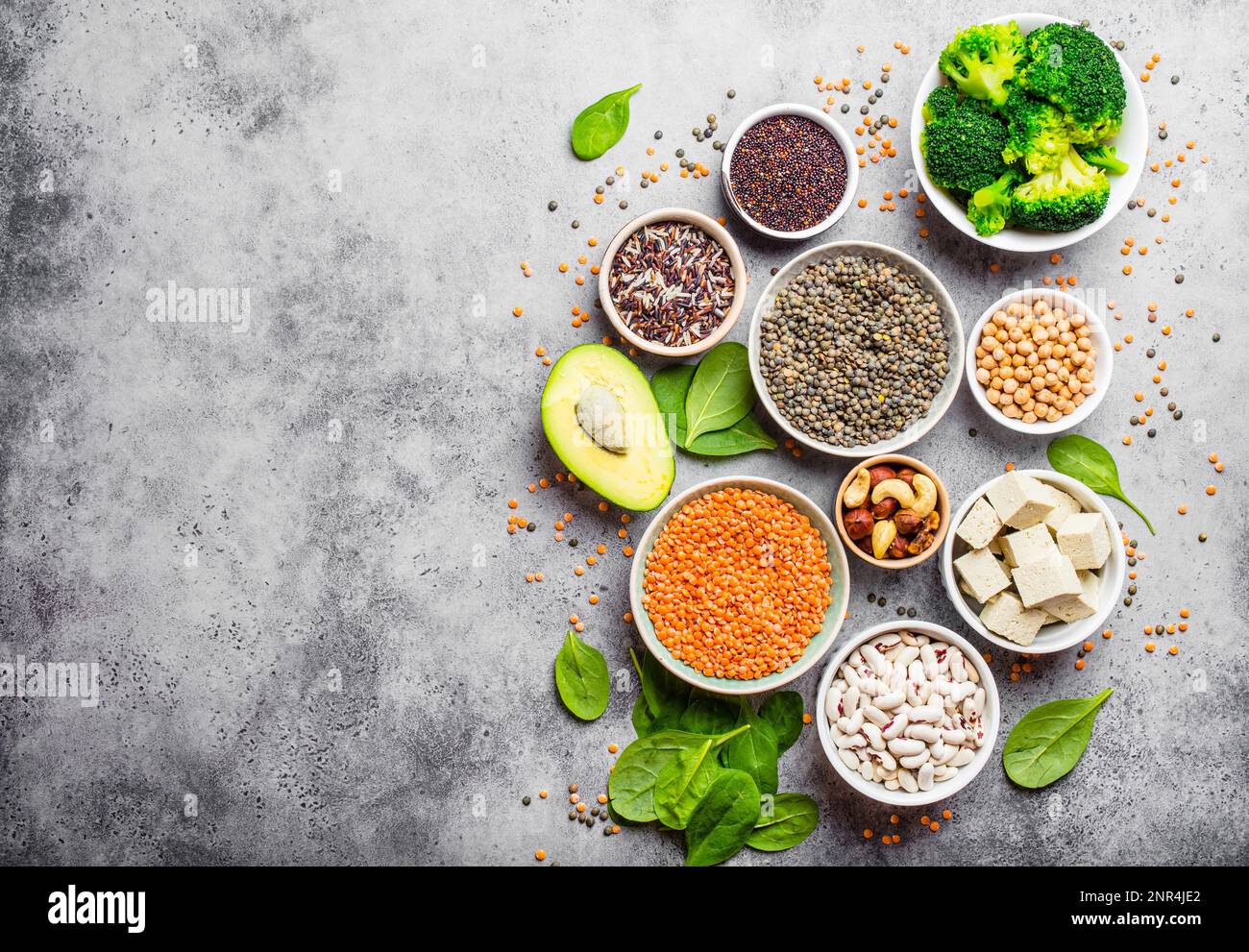 Variety of nutrient-rich food for vegans with copy space: beans ...