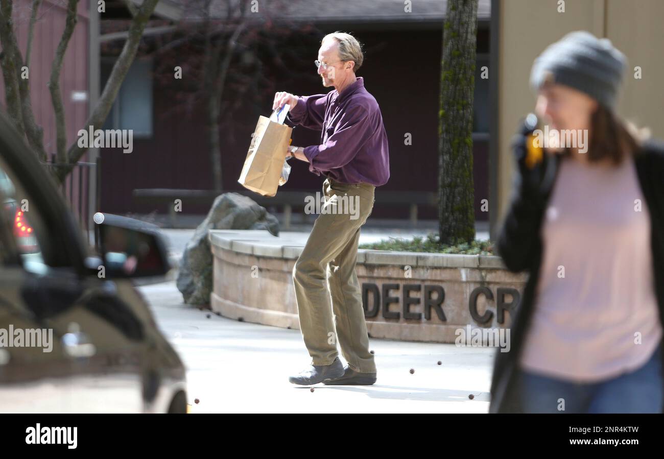 Deer Creek Elementary School first grade teacher John Carr hands an ...