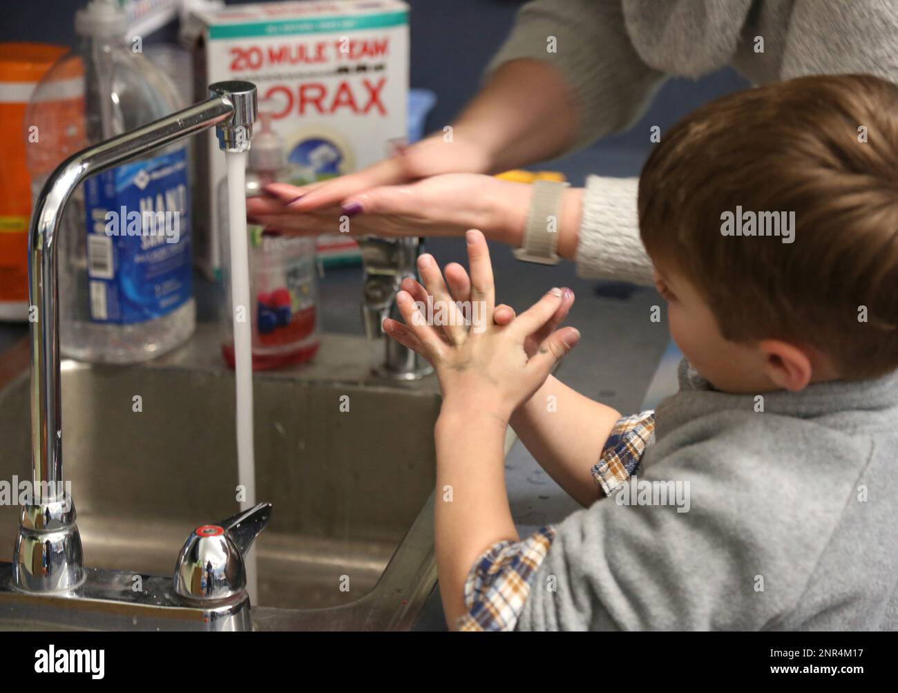 Children are shown proper hand washing procedures at a day care for ...