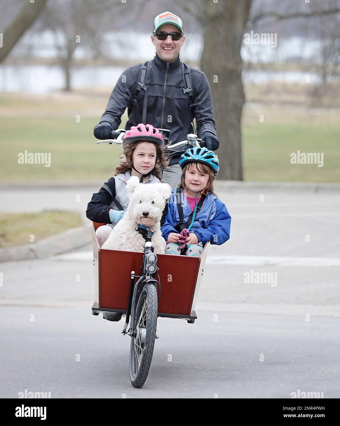 In this Friday, March 27, 2020 photo, Jeff Reimann and his daughters ...