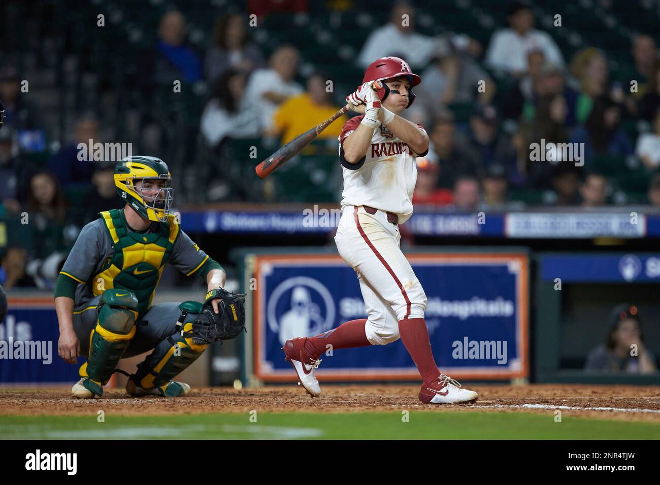 Robert Moore (1) of the Arkansas Razorbacks follows through on his ...