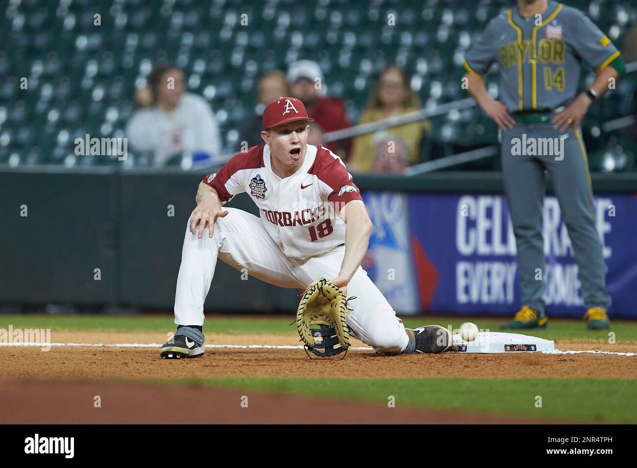 Arkansas Razorbacks first baseman Heston Kjerstad (18) tries to pick a ...