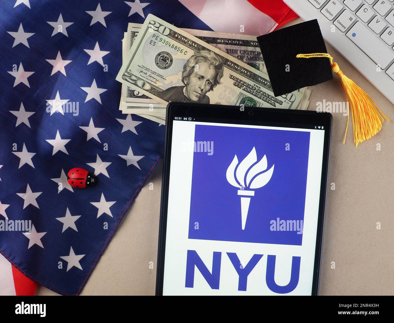 IIn this photo illustration, New York University (NYU) logo seen ...