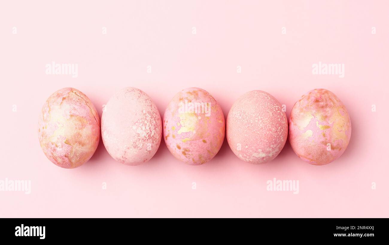 Easter eggs in row, pastel pink banner, Easter background Stock Photo ...