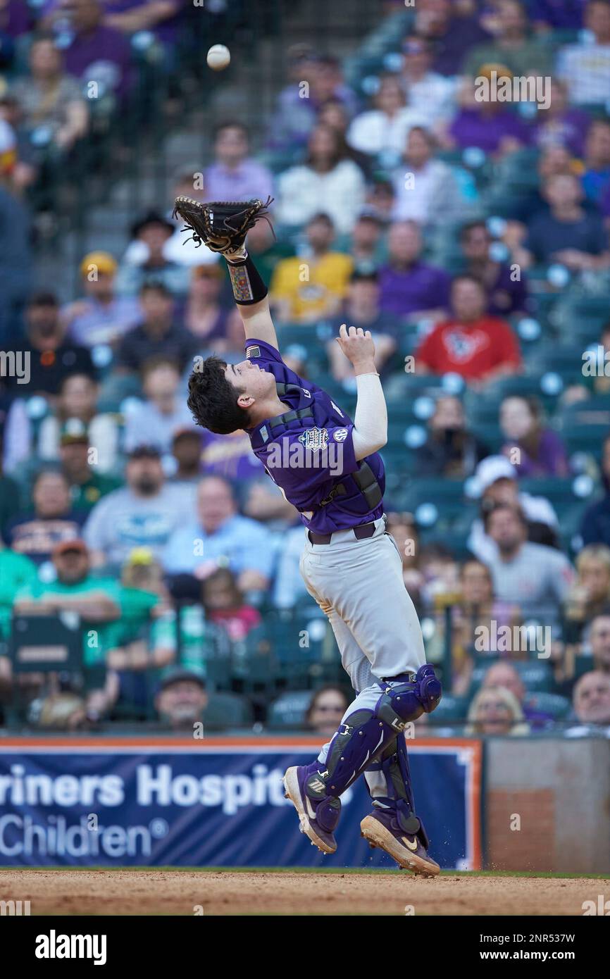 LSU Tigers catcher Alex Milazzo (20) catches a pop fly behind home ...