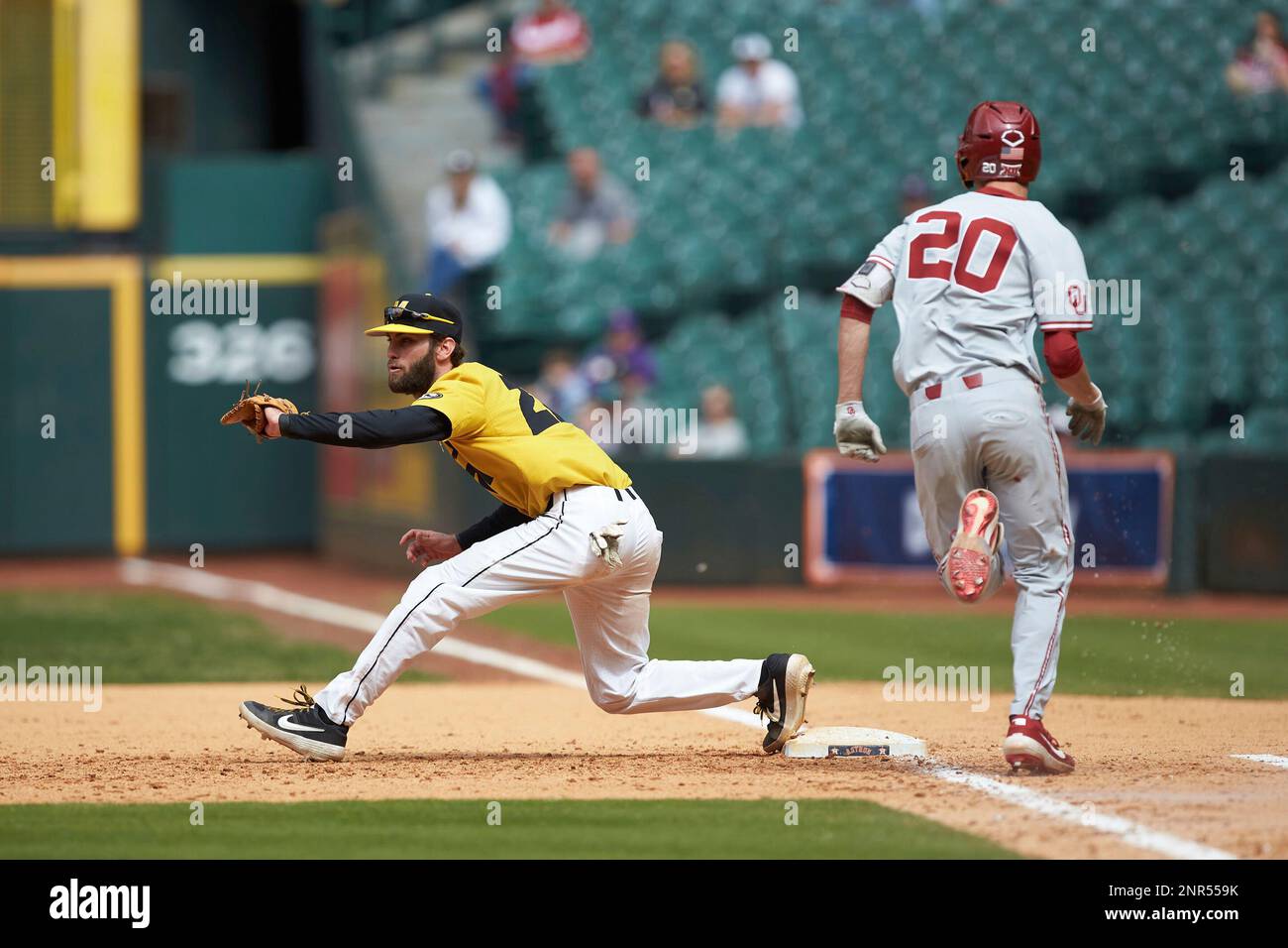 Missouri Tigers first baseman Brandt Belk (21) stretches for a throw as ...