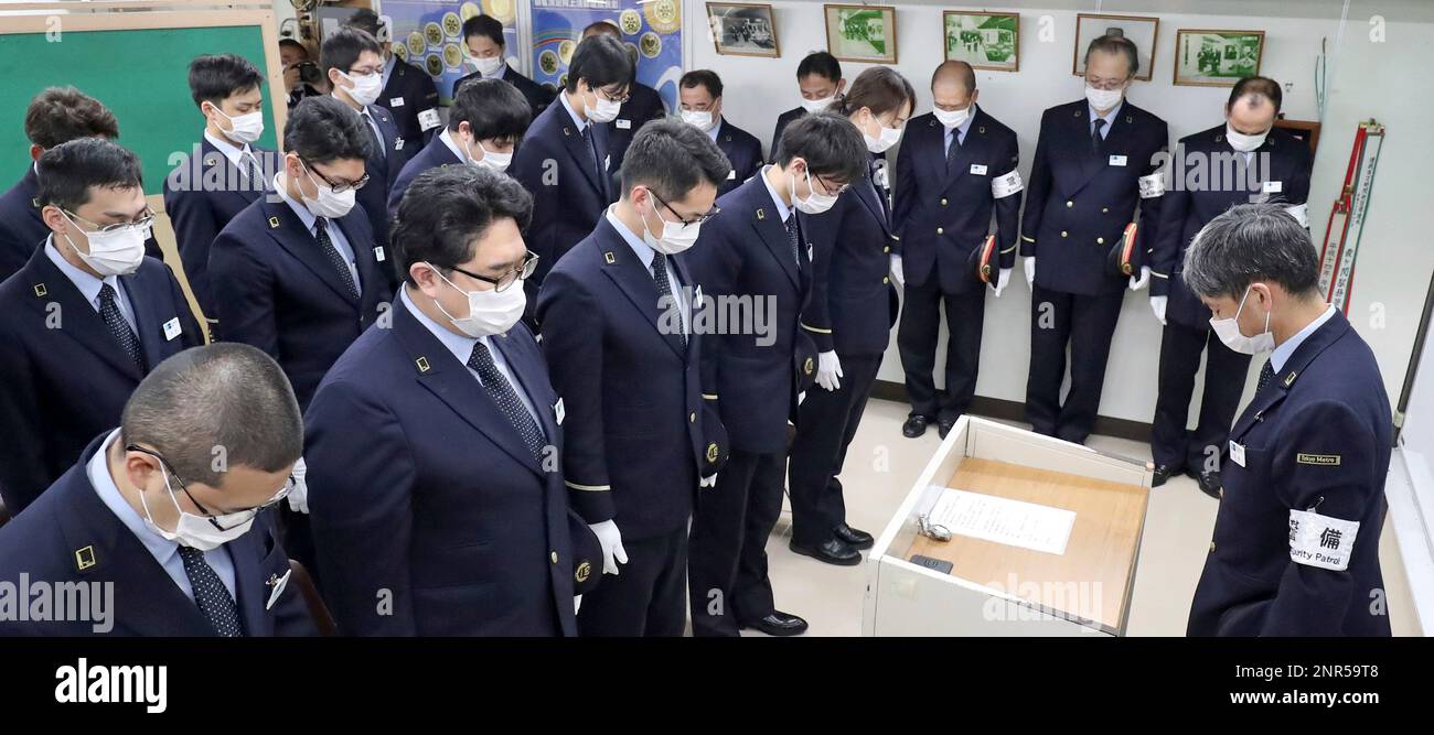 Station staffs offer flowers for victims who were killed in the sarin ...