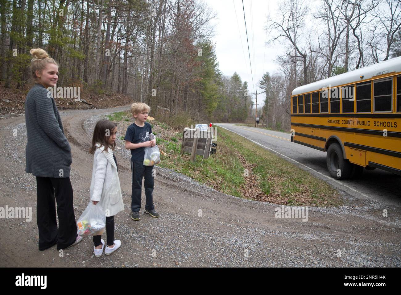 Macy Kate Garner, 18, a senior in high school, walks with her siblings ...