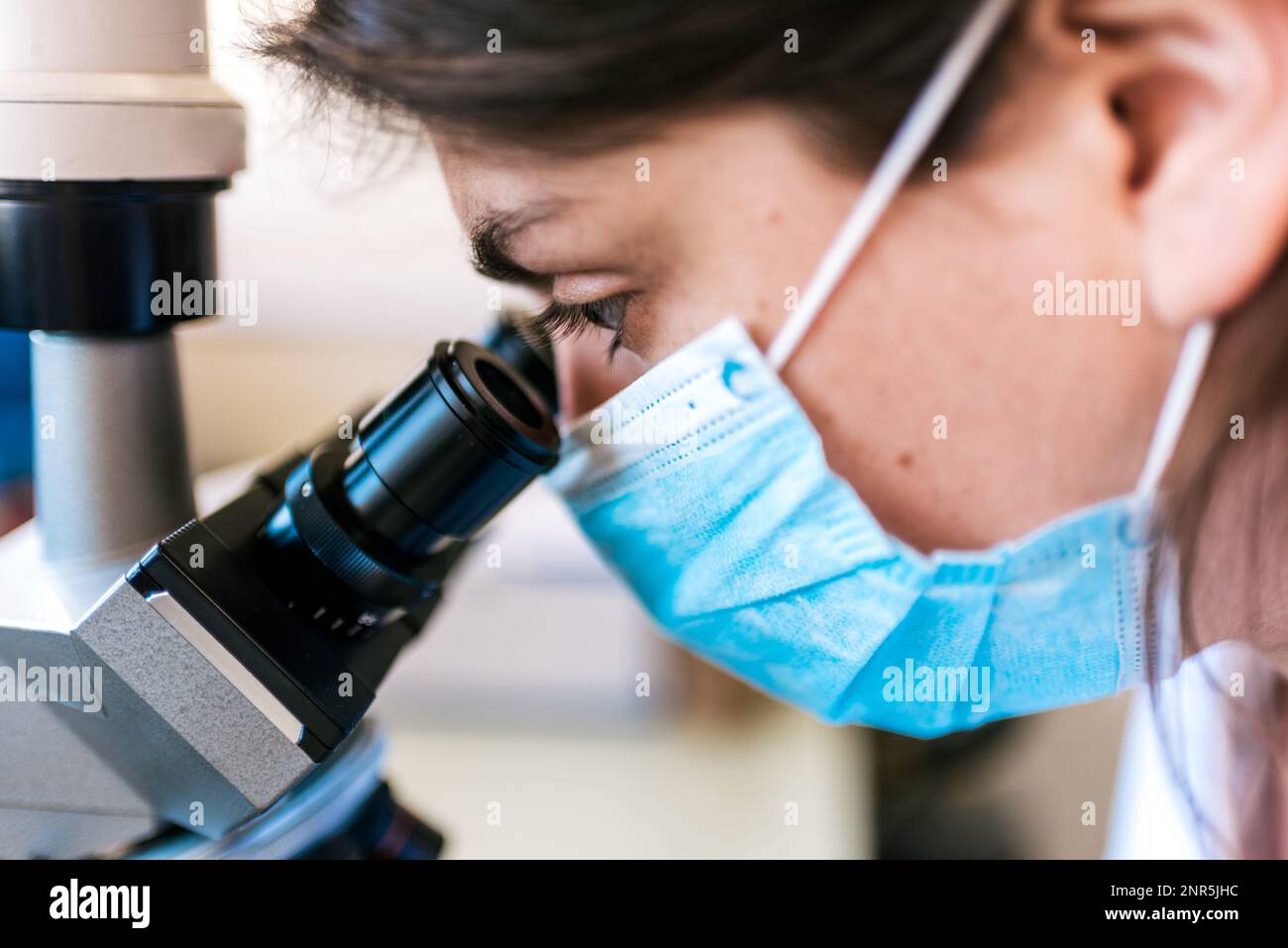 Closeup Female Scientist Using Microscopy in Laboratory Stock Photo - Alamy
