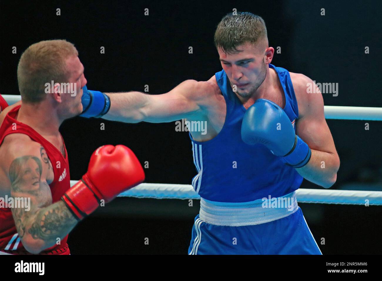 Luka Plantic of Croatia, wearing red and Umar Dzambekov of Austria ...