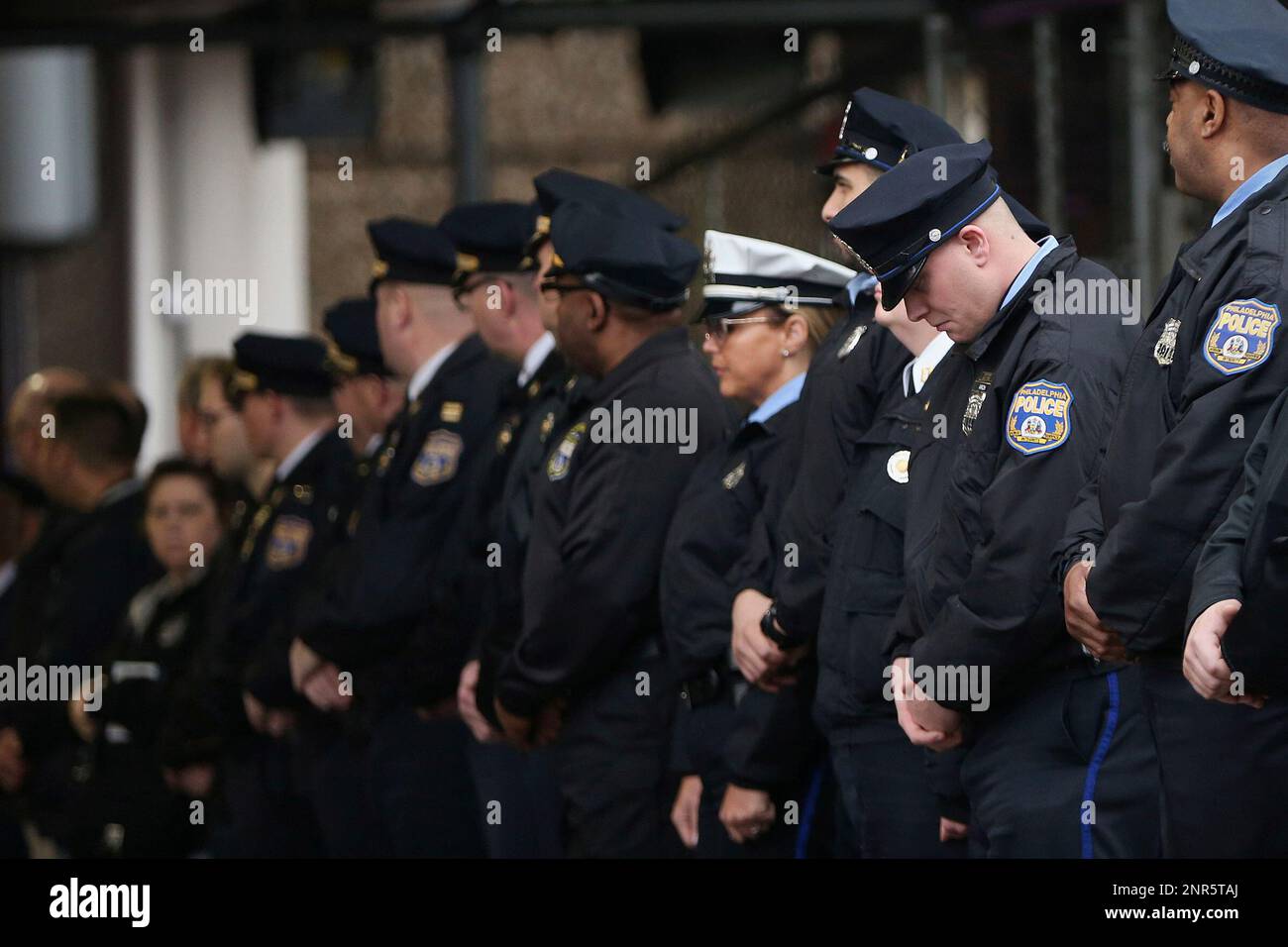 Philadelphia police officers line up after the body of SWAT Cpl. James ...