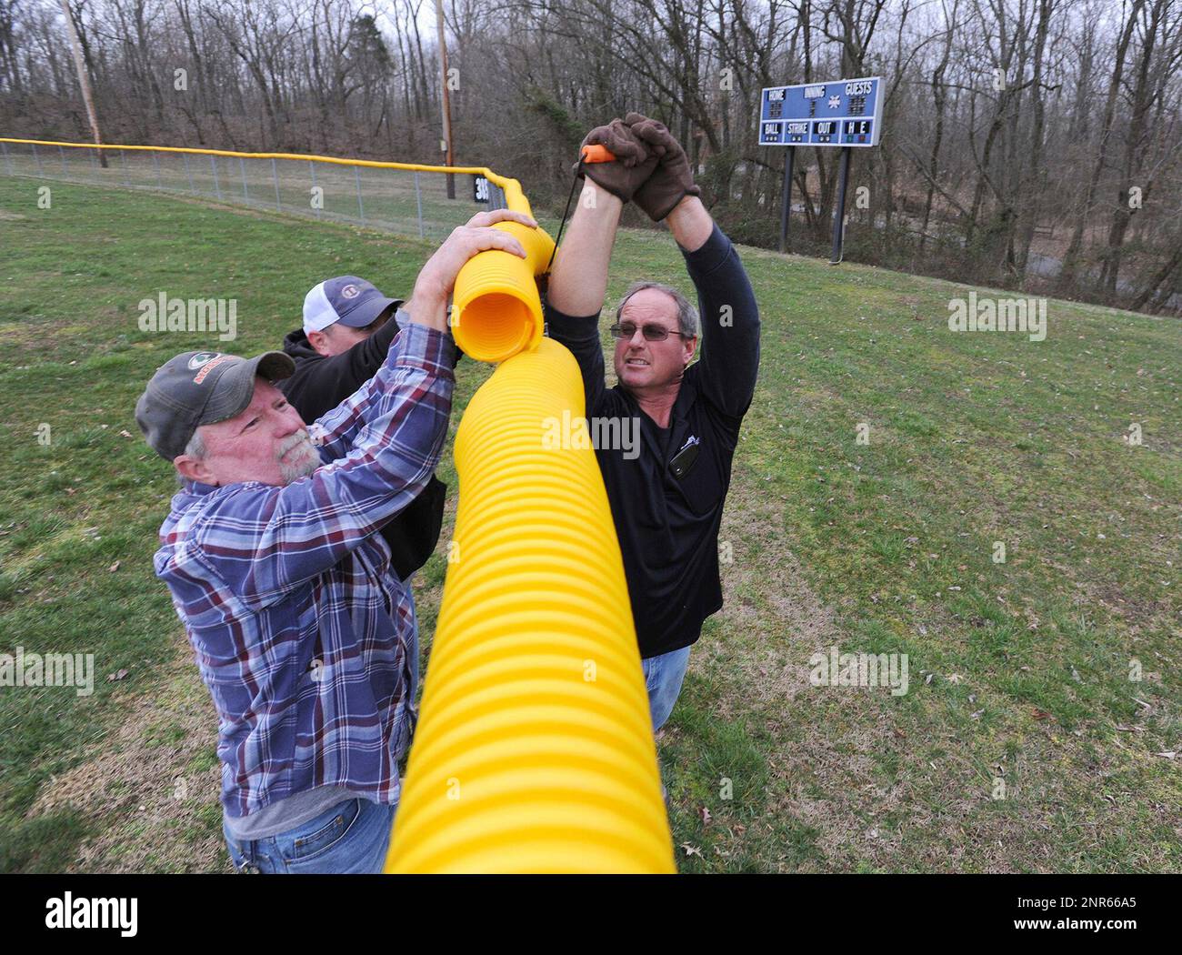 Terry Robertson, left, Carsten Tindle and Steve Wilkerson, install new ...