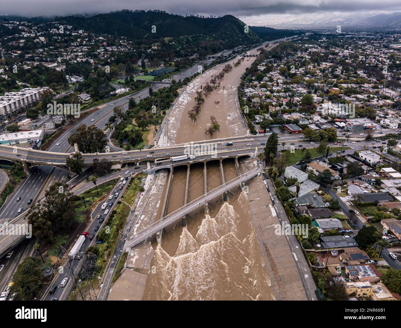 Drone view of a rain water swollen Los Angeles River in the Los Feliz ...