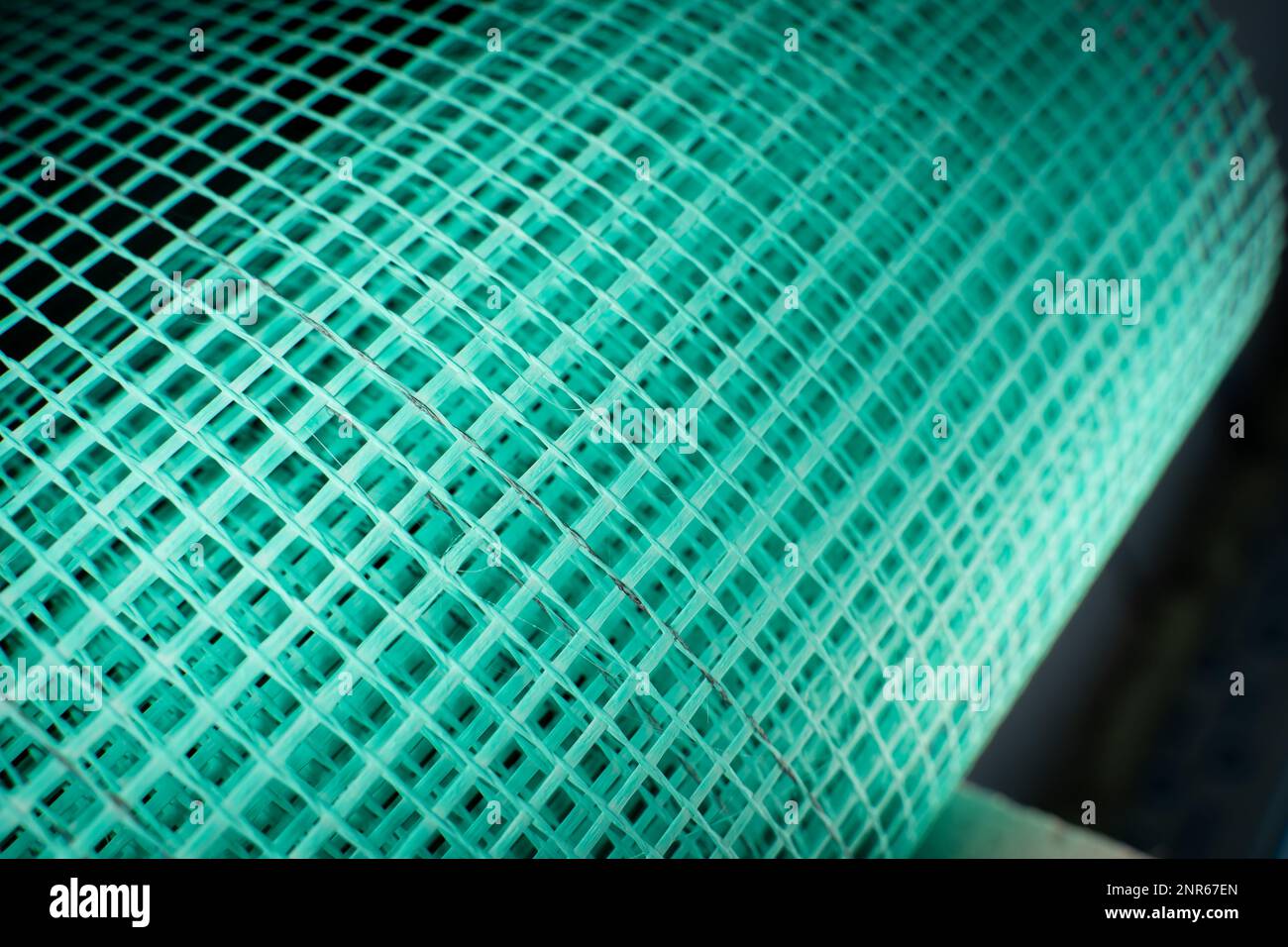 Plastic reinforcing facade mesh in green color close-up. Plaster mesh ...