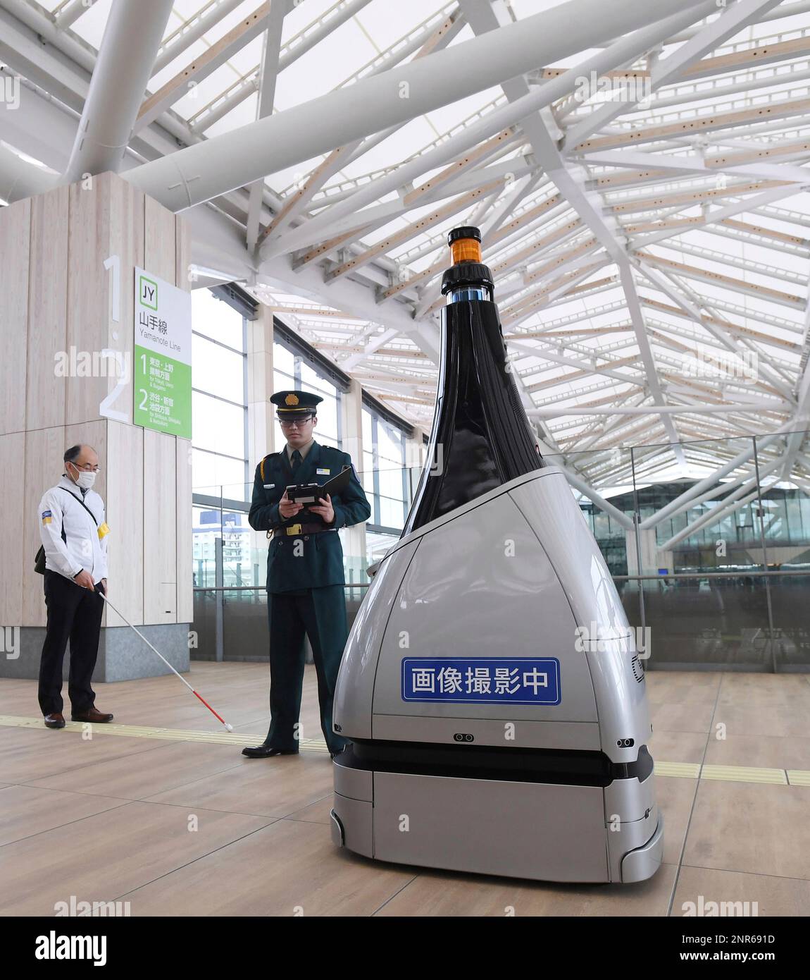 A guard robot, which can transport the information of passenger who ...