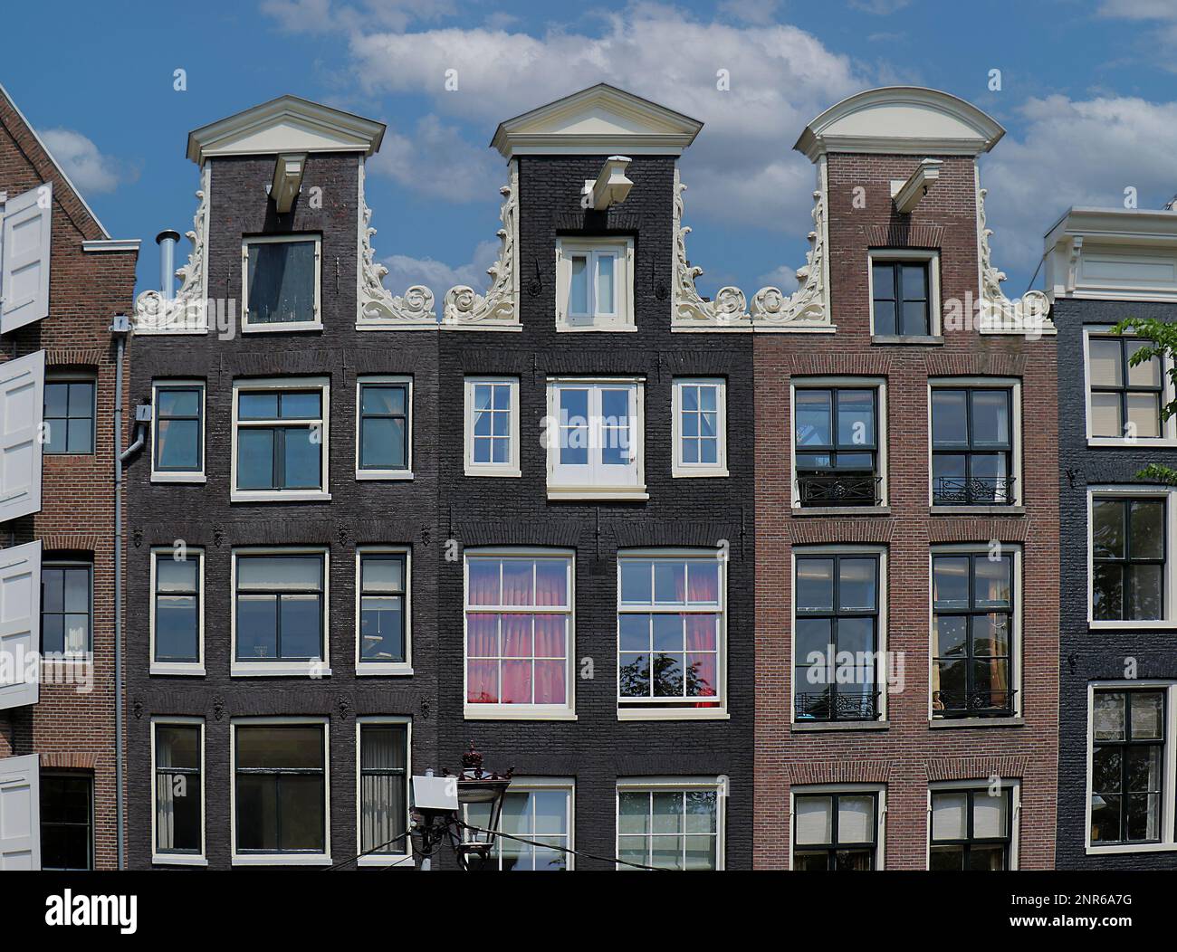 Traditional Amsterdam architecture buildings with brick wall facades ...