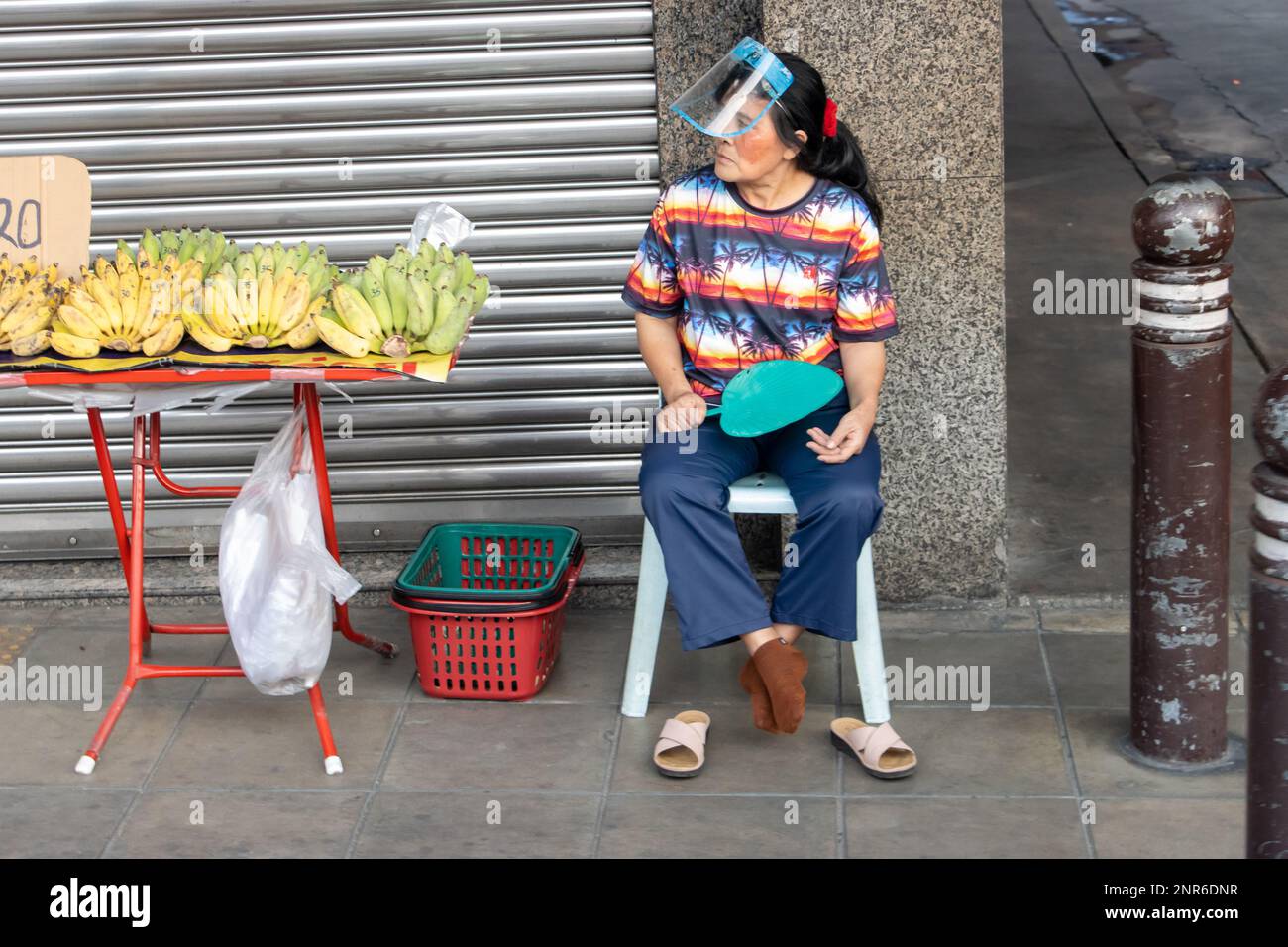 BANGKOK, THAILAND, FEB 04 2023, A woman with a protective face shield ...