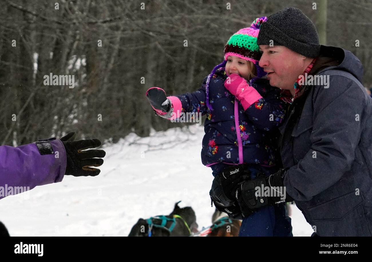Musher Michelle Phillips reaches for the hand of a young fan at the ...