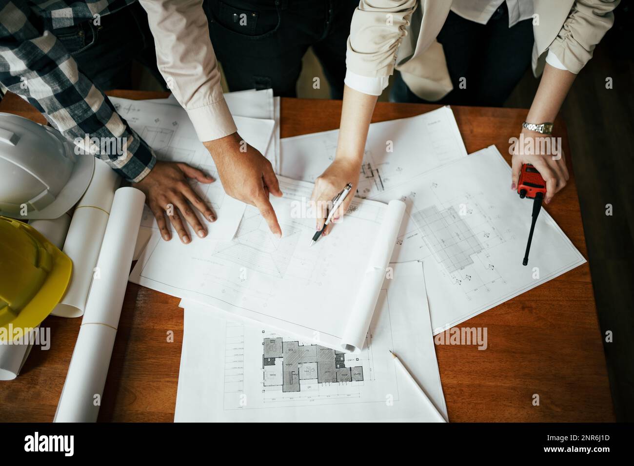 Team Of Architect And Engineer Working And Discussing About New Startup Project On Desk