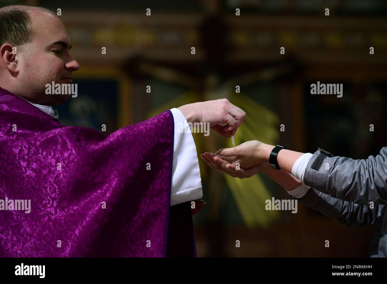 Hungarian priest Laszlo Monostori hands over the wafer during the ...