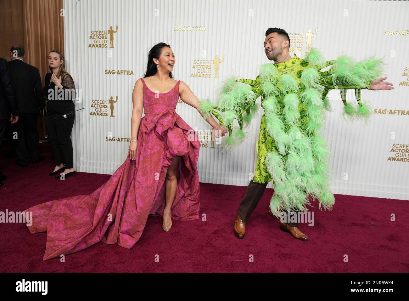 Stephanie Hsu, left, and Denny Directo pose in the press room at the ...
