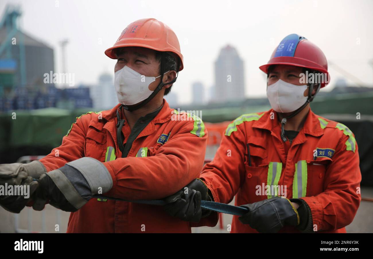 Workers load the Class S14 diesel-electric multiple units (DEMU) trains ...