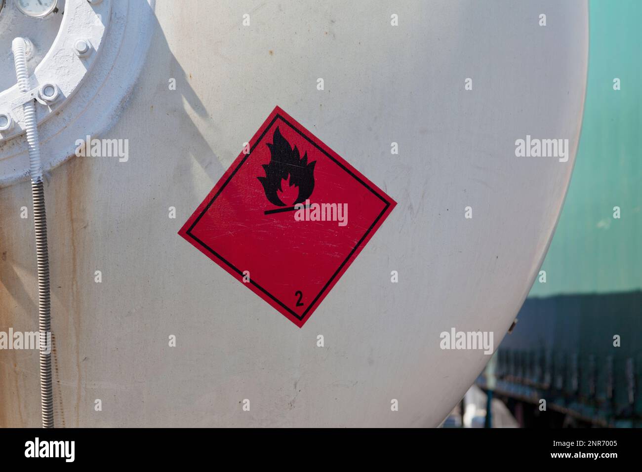 Dangerous goods sign on a tank truck back. The red placard indicate the ...
