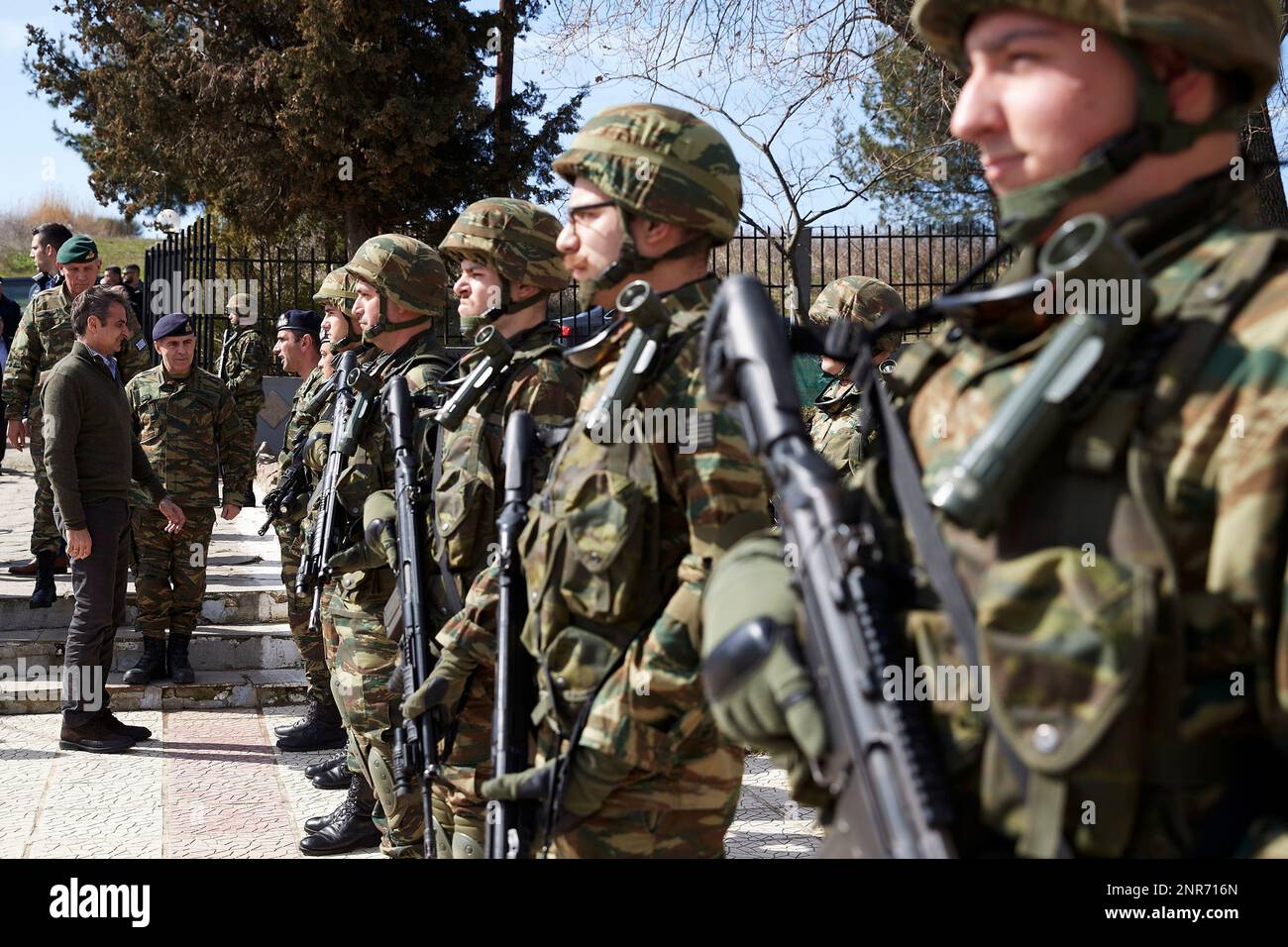 Greece's Prime Minister Kyriakos Mitsotakis, left, reviews Greek ...