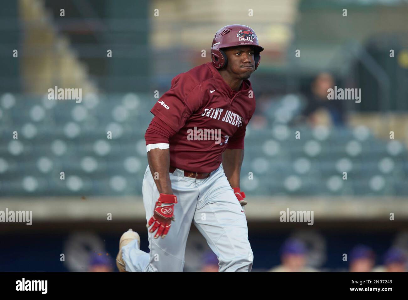 Tim Johnson (32) of the Saint Joseph's Hawks hustles down the first ...