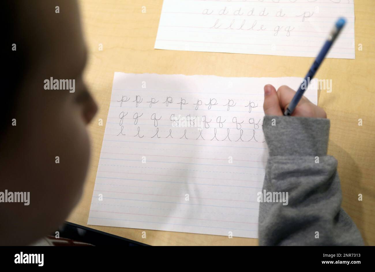 Julia Gray of Mossic practices writing letters in cursive at the ...