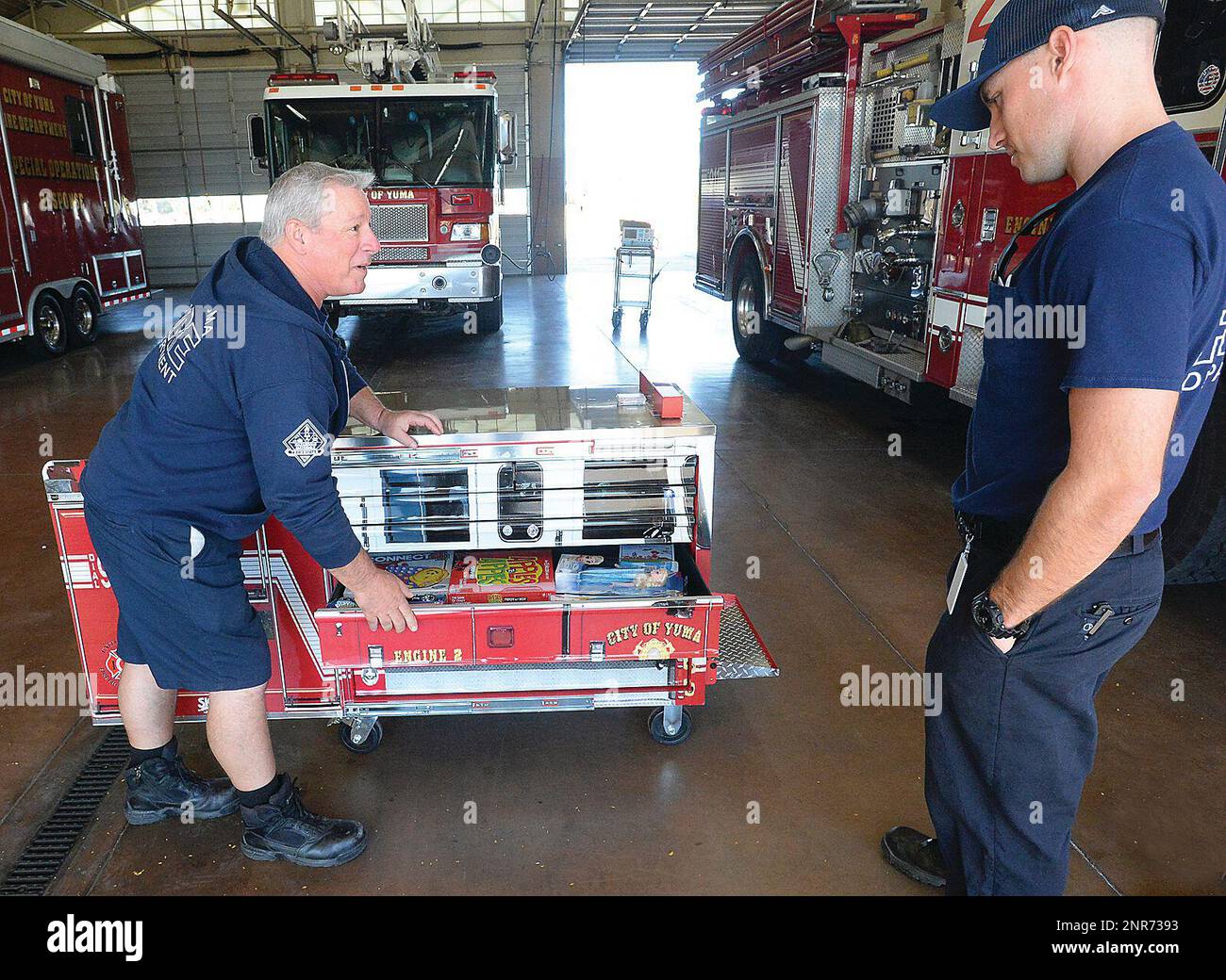 Yuma Fire Department Capt. Paul Evancho (left) shows firefighter Justin ...