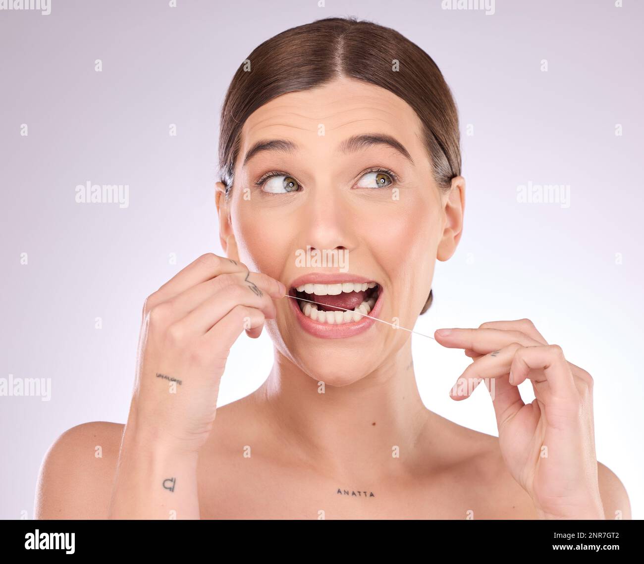 Flossing, woman and teeth in studio for beauty, healthy dental wellness ...