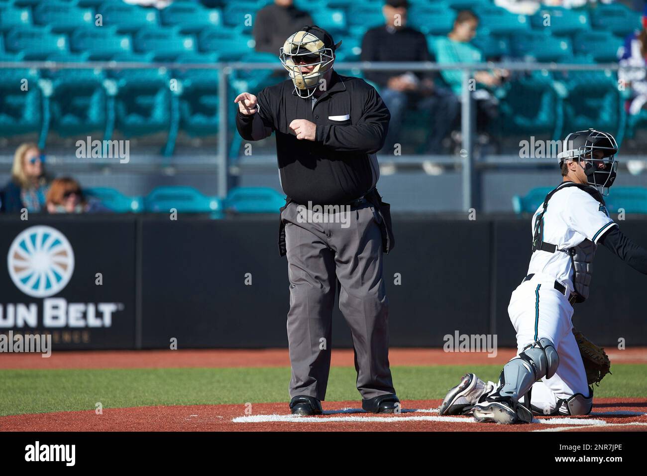 Home plate umpire Craig Mirr makes a strike call during the game ...