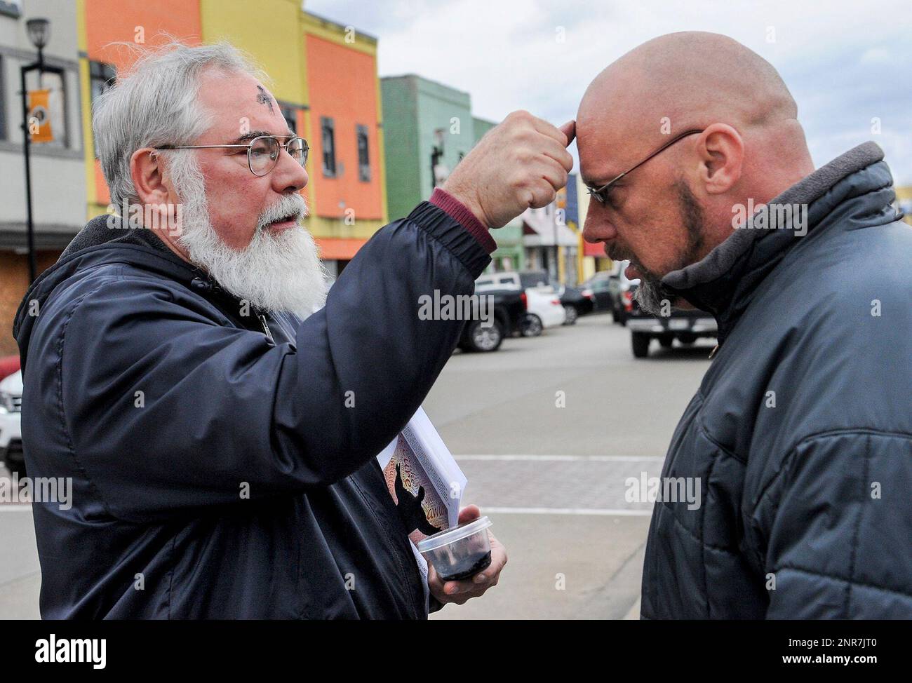 Retired United Methodist Pastor David Biondi places ashes on the ...