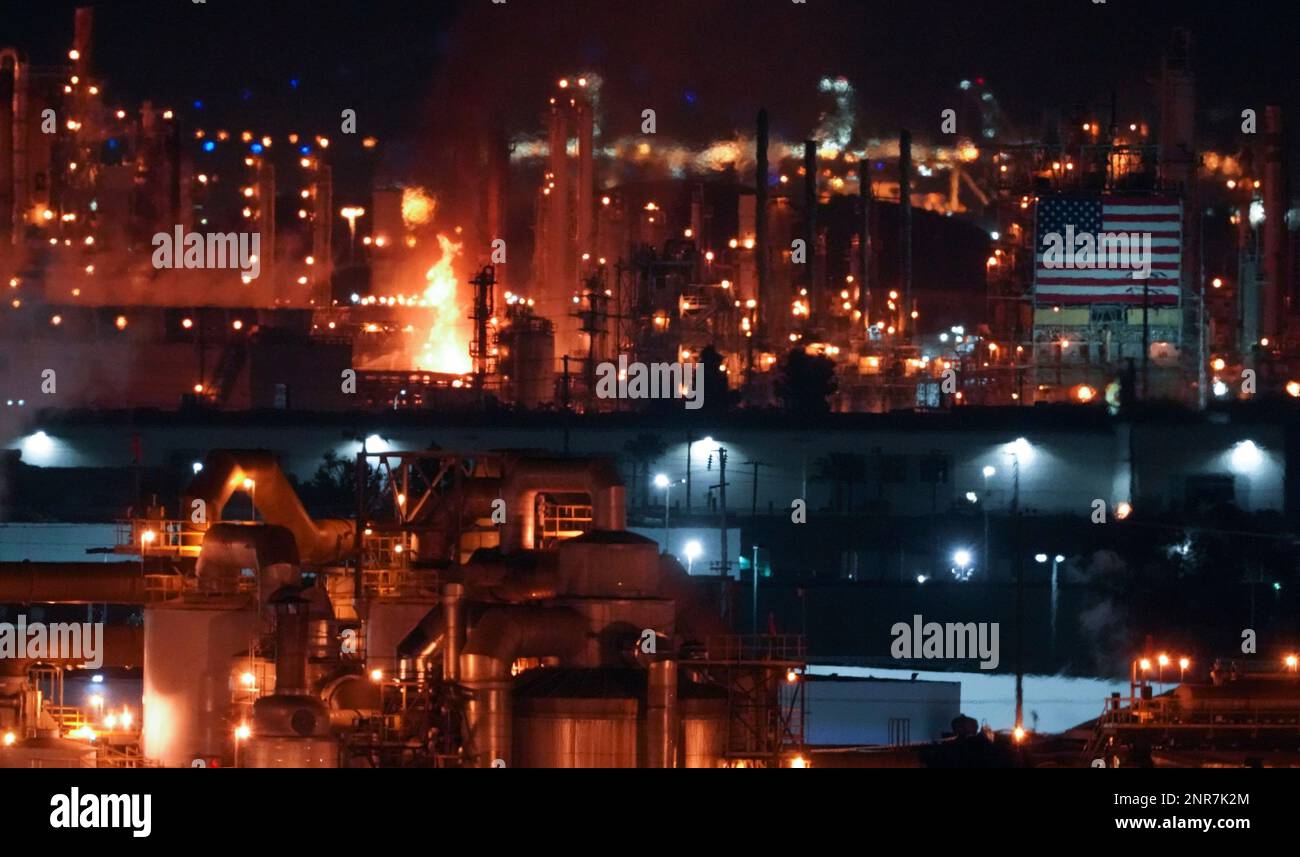 A fire burns after an explosion at the Marathon Refinery in Carson ...