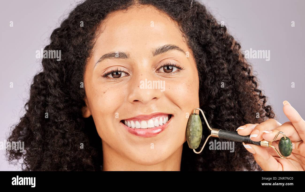 Jade facial roller, portrait and black woman with face skin glow and ...