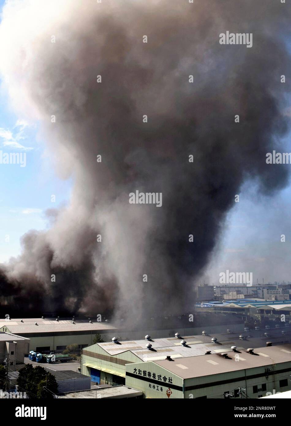 A photo shows a black smoke rising from warehouses in Sakae, Funabashi ...