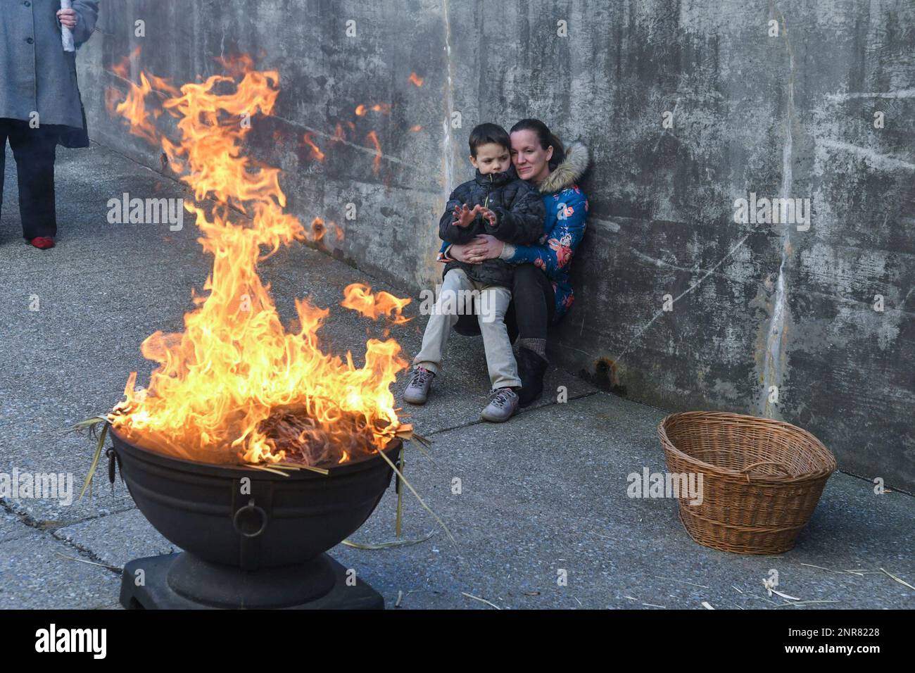 Leah Clews, of Pottsville, Pa., and son Wyatt, 6, watch the palm burn ...