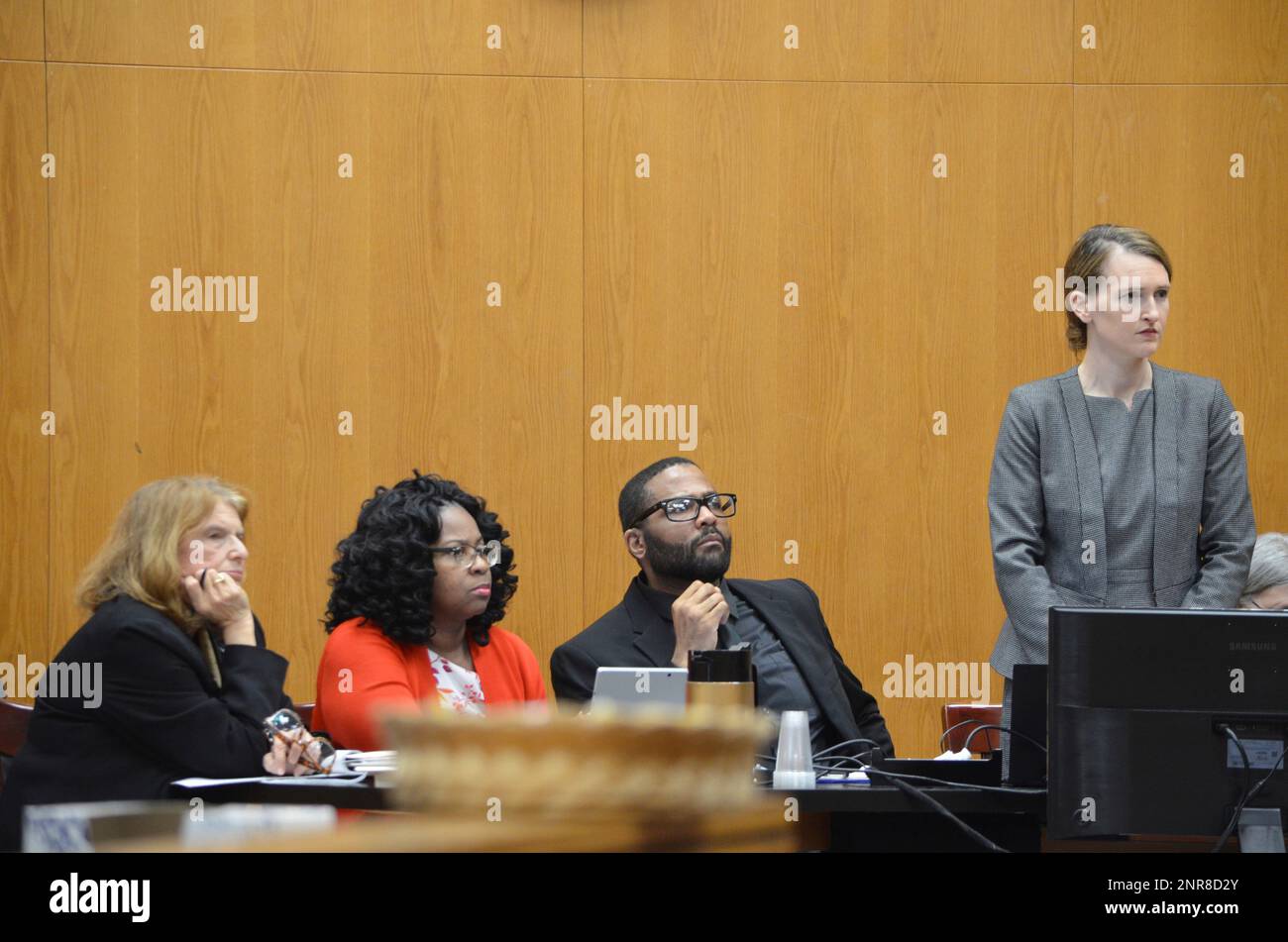The defense team of Willie Cory Godbolt, second from right, listens to ...