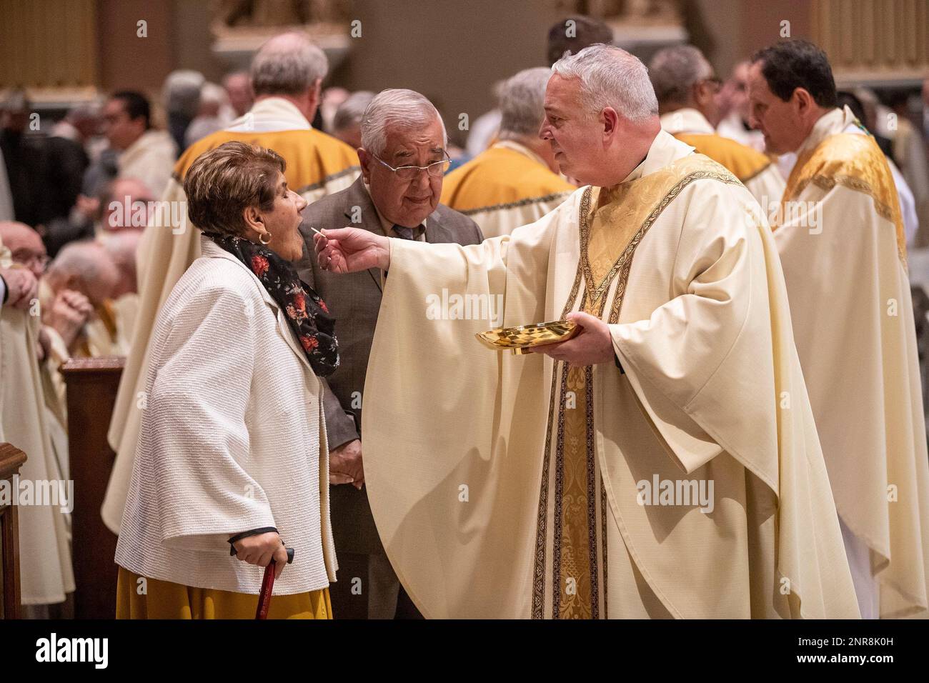 The new Archbishop of Philadelphia, Nelson J. Pérez, right, offers the ...