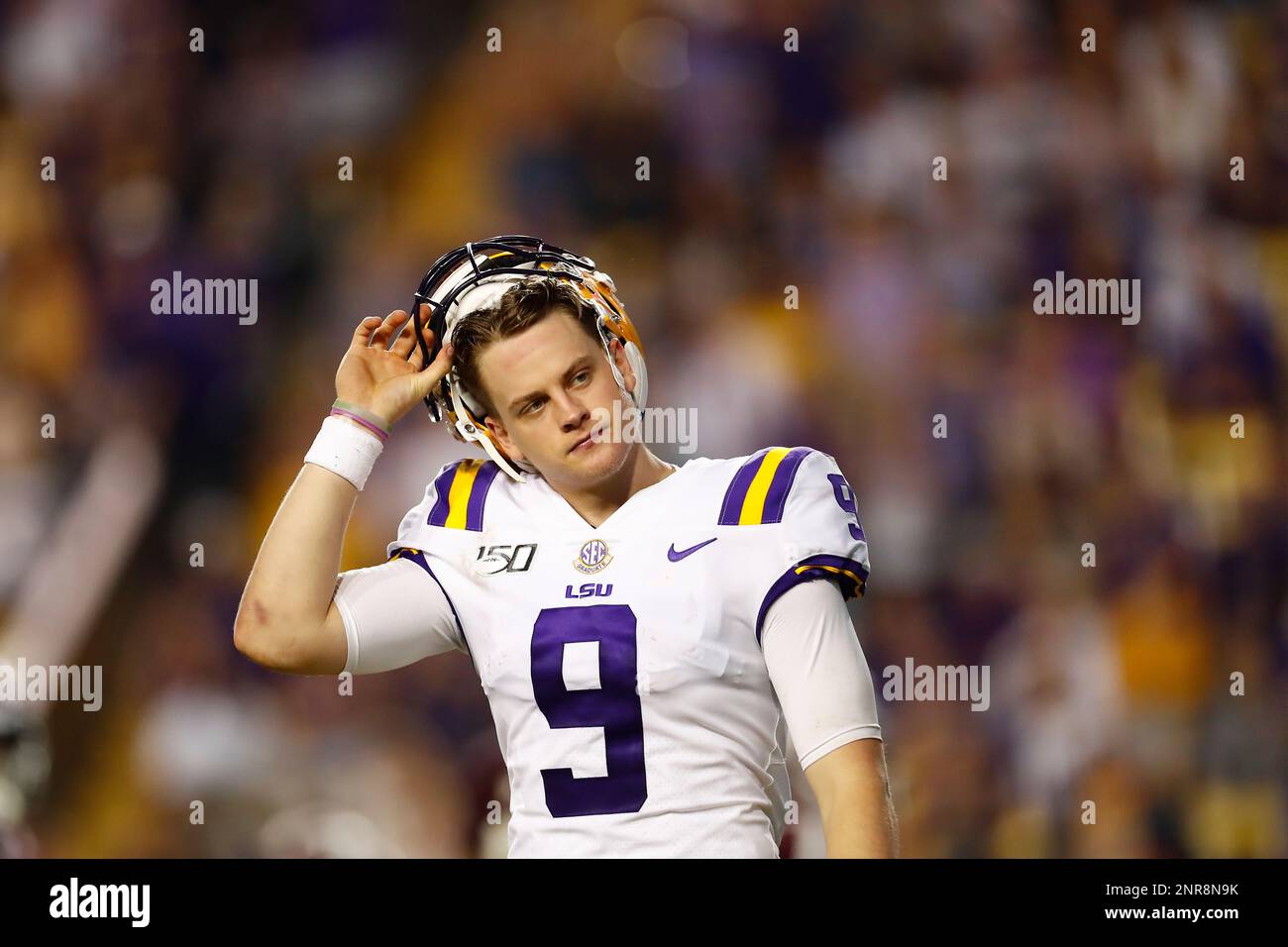 LSU quarterback Joe Burrow (9) takes his helmet off after being taken ...