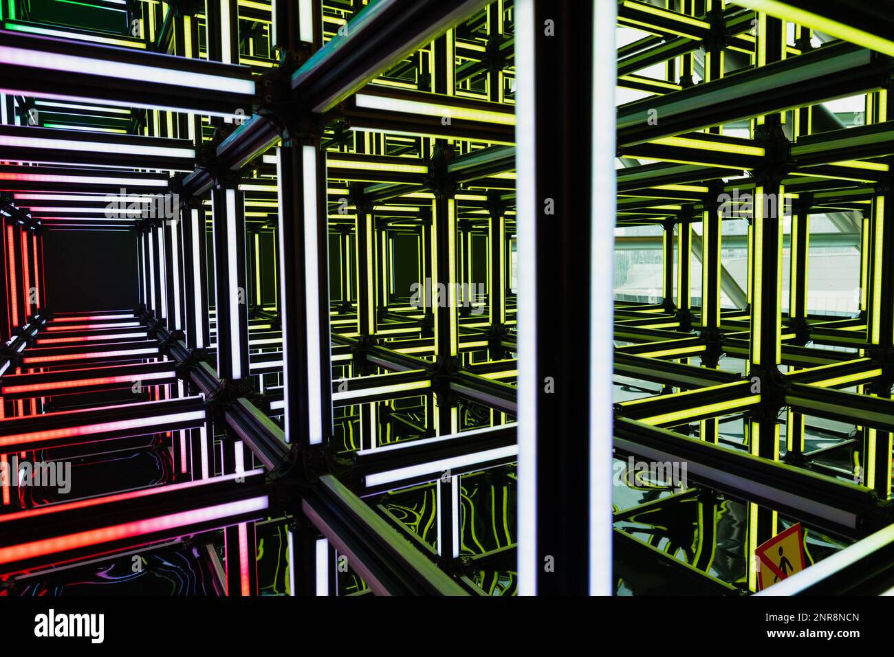 Futuristic neon red yellow white light cube art installation ...