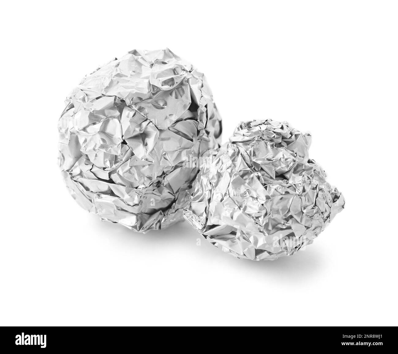 Crumpled balls of aluminium foil on white background Stock Photo - Alamy