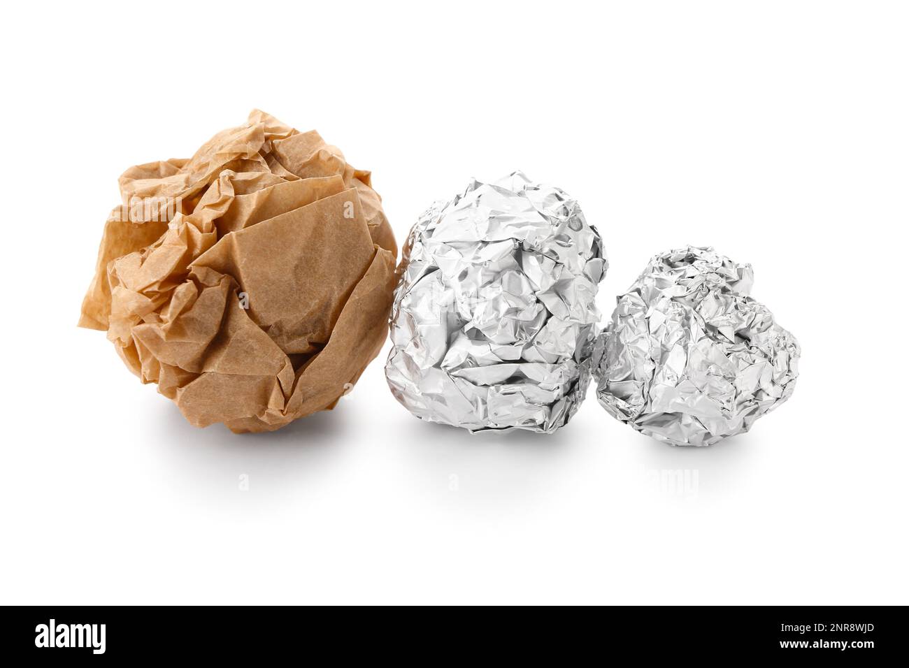 Crumpled balls of aluminium foil and baking paper on white background Stock Photo - Alamy