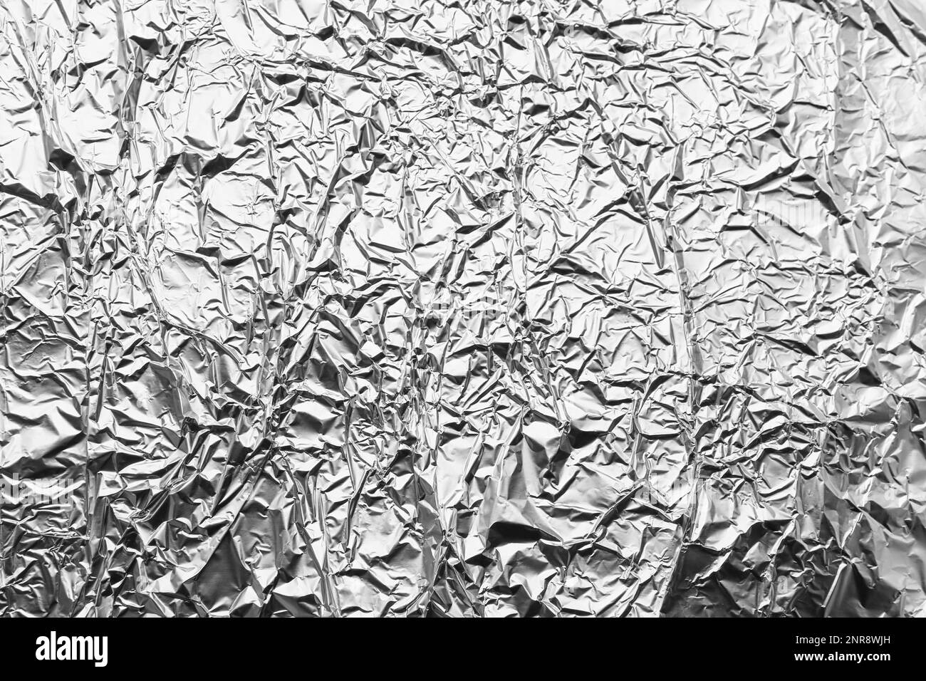 Crumpled aluminium foil as background, closeup Stock Photo - Alamy