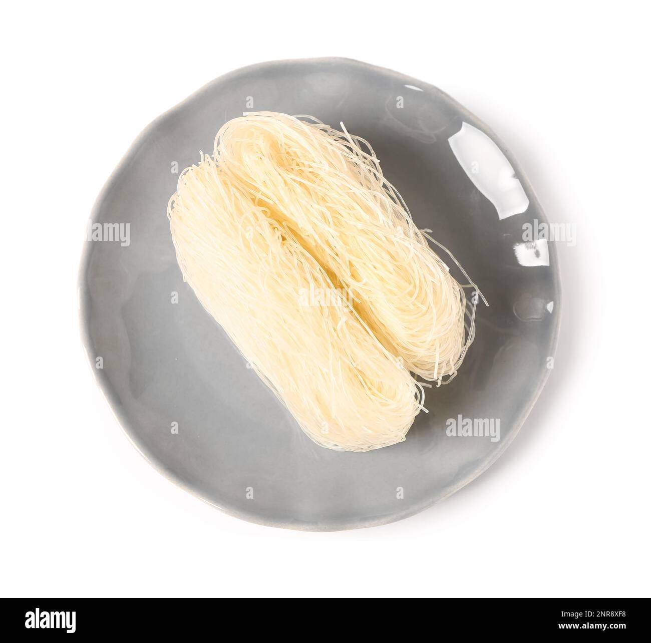 Plate with raw rice noodles isolated on white background Stock Photo ...