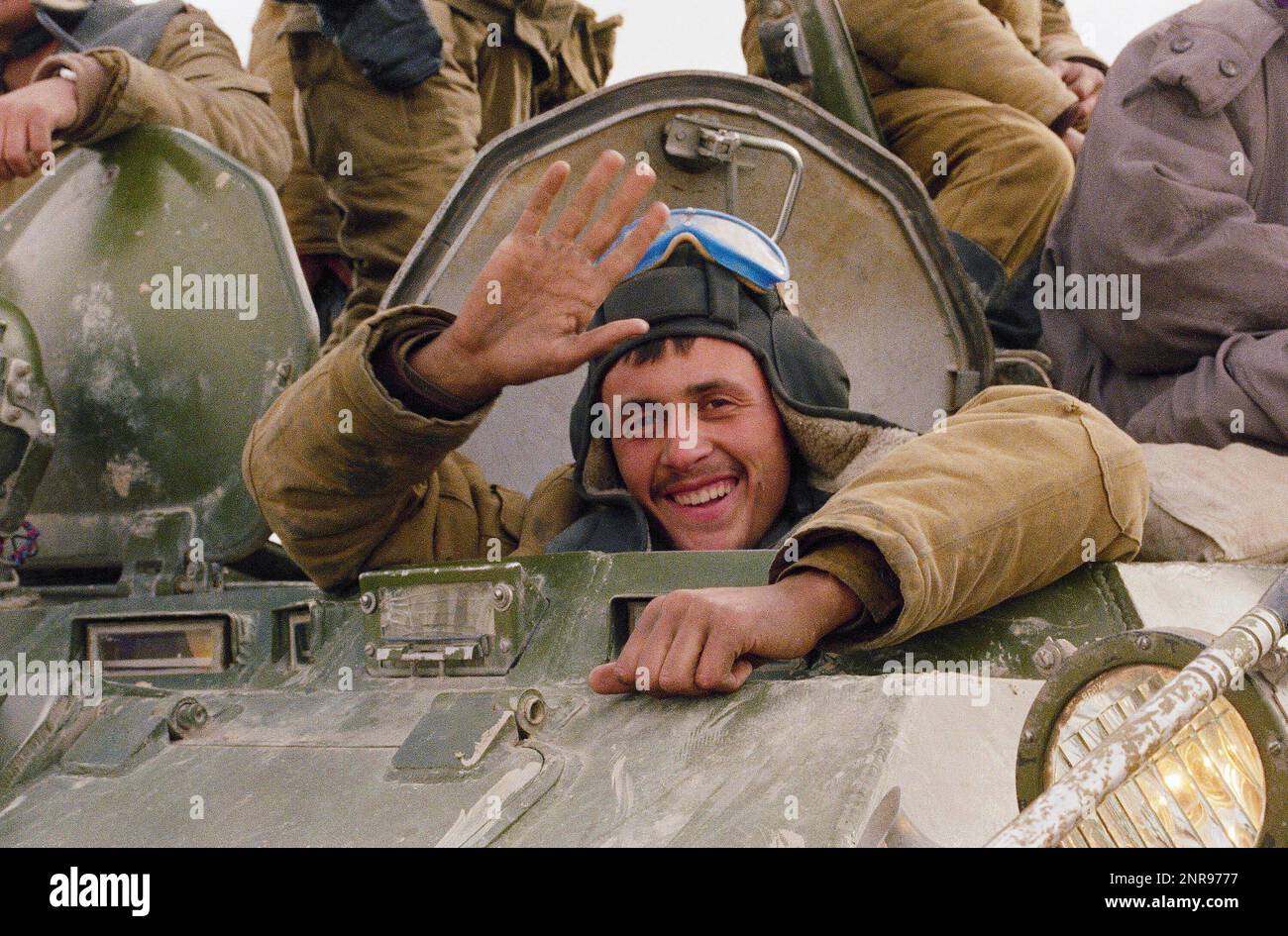 FILE - In this Feb. 7, 1989 file photo. a Soviet soldier waves as his ...