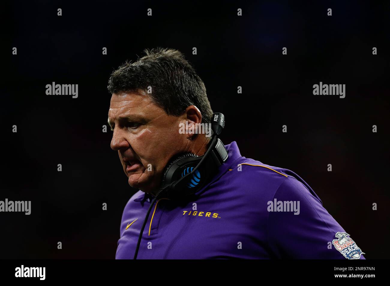 LSU head coach Ed Orgeron coaches from the sideline during the Peach ...